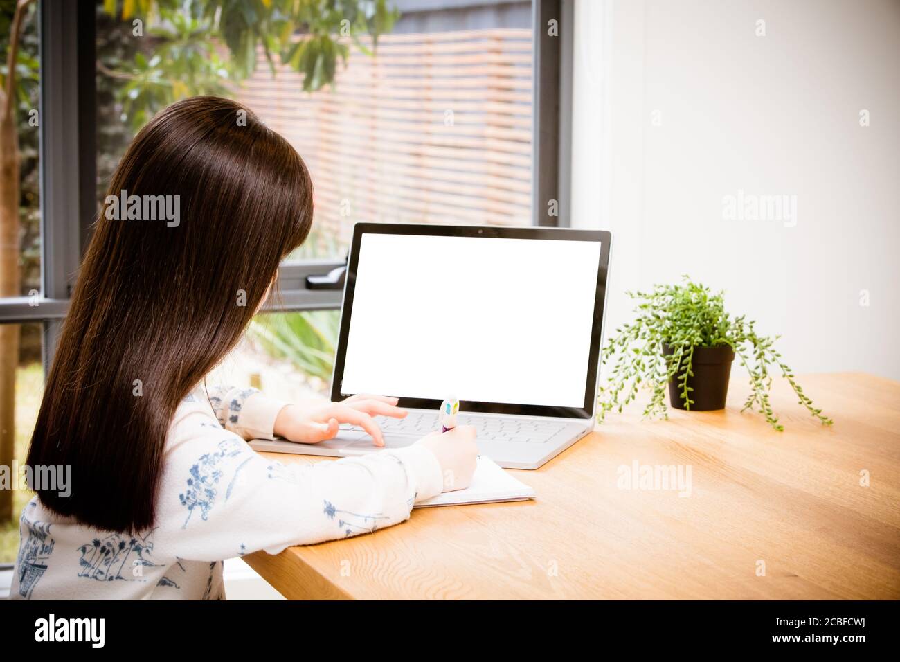 Child Uses a Computer for School Work Stock Photo - Alamy