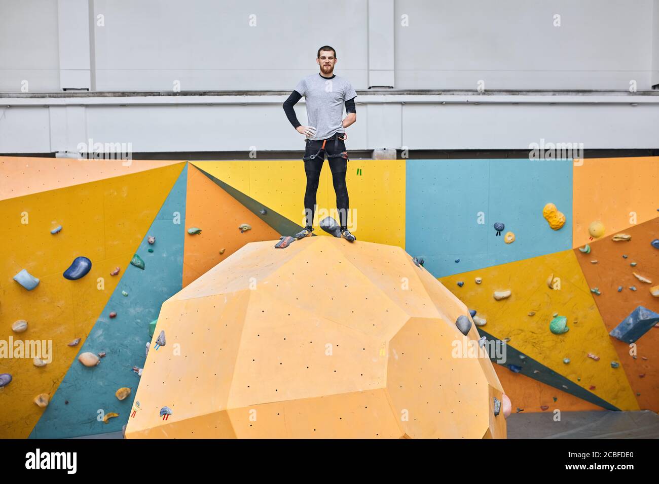 Physically impaired handsome male model posing at the top of climbing ...