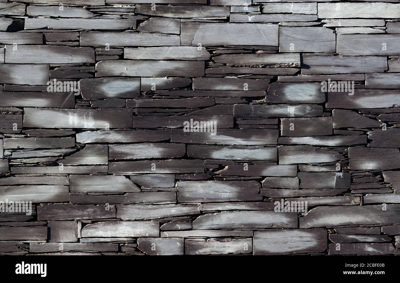 Wet slate brick wall background texture Stock Photo - Alamy
