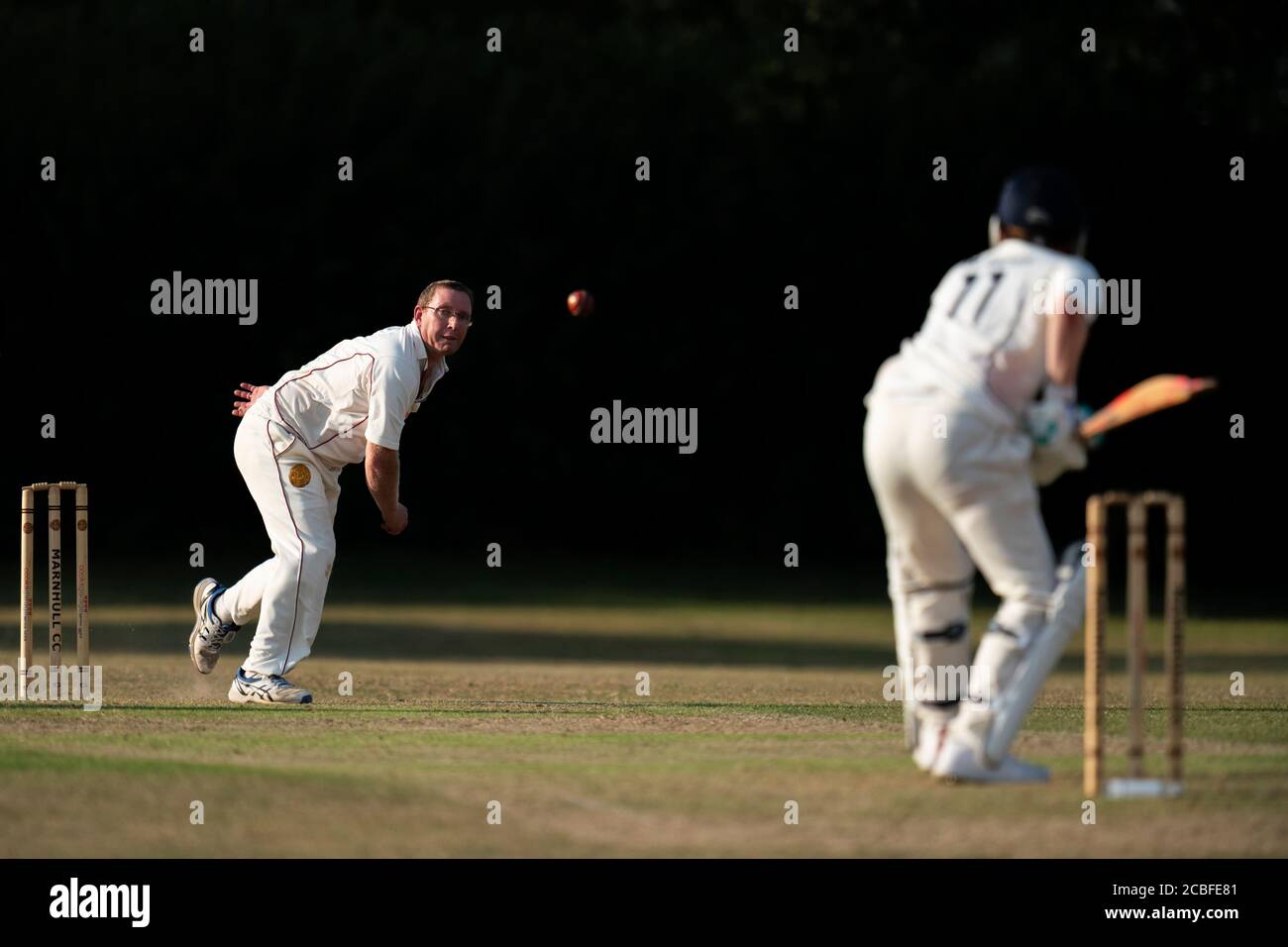 Bowler in action Stock Photo - Alamy