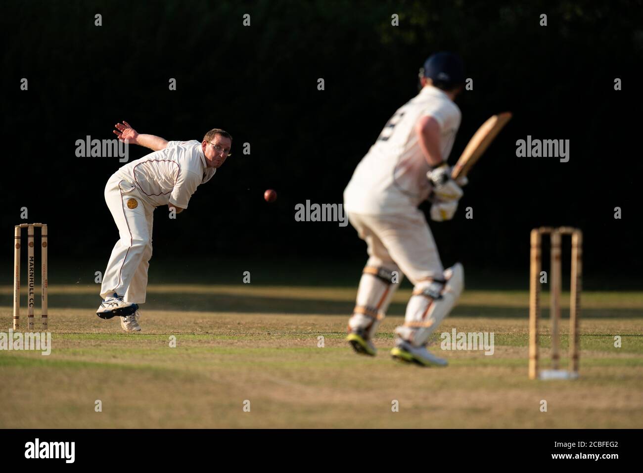 Cricket bowler delivering ball hi-res stock photography and images - Alamy