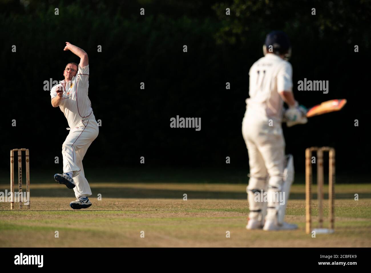 Cricket bowler delivering ball hi-res stock photography and images - Alamy