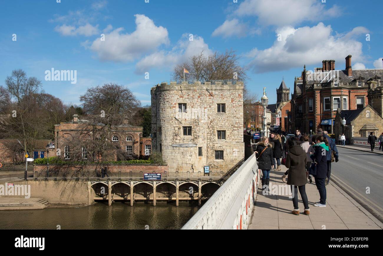 Tourists walking across Lendal Bridge crossing the River Ouse in the ...