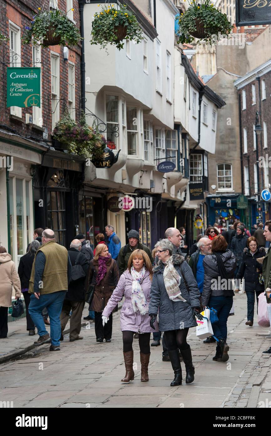Tourists visiting shops in the centre of the City of York, Yorkshire ...