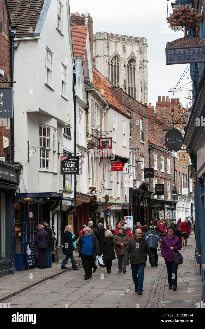 Tourists visiting shops in the centre of the City of York, Yorkshire ...