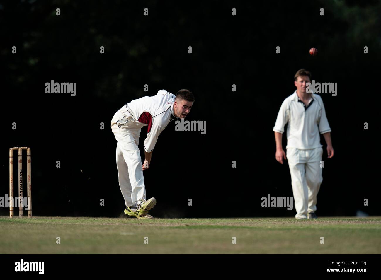 Bowler in action Stock Photo - Alamy