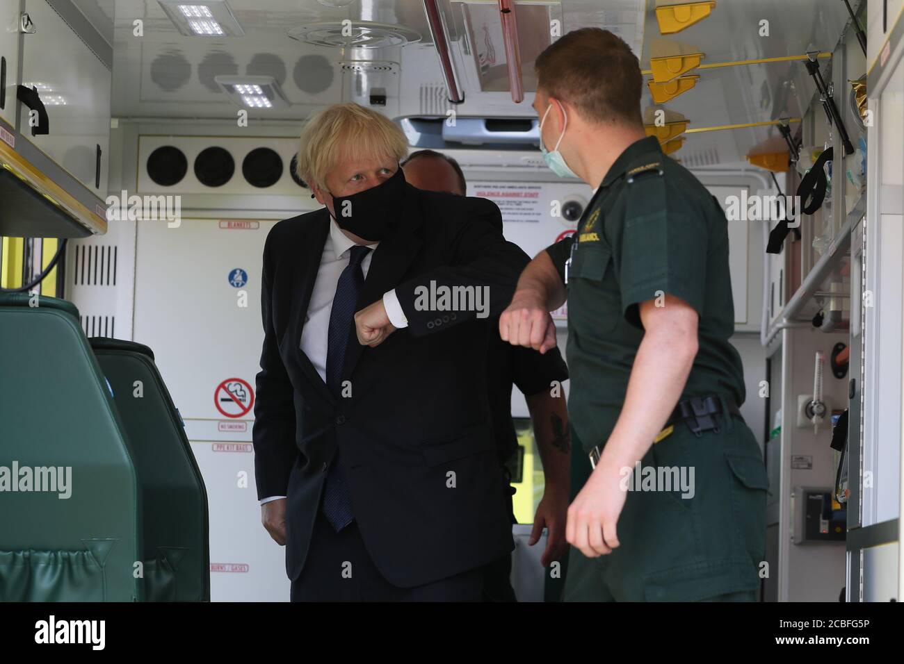 Prime Minister Boris Johnson elbow bumps trainee paramedic, Darryl ...