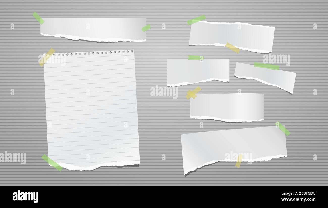 Torn of white note, notebook paper strips and pieces stuck with sticky ...