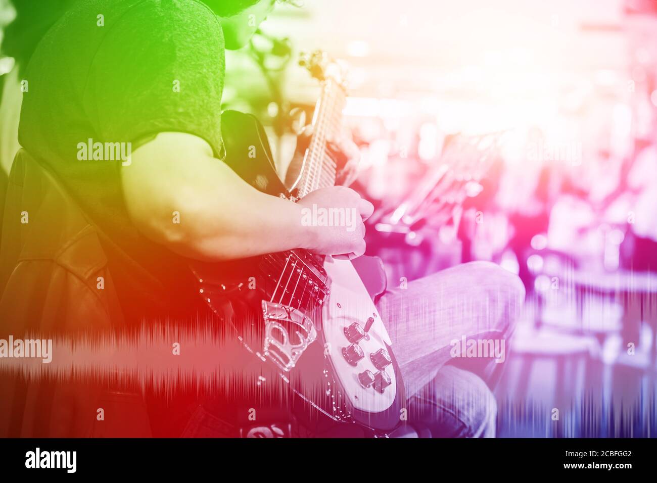 musician guitarist with overlay colorful effect for music entertainment ...