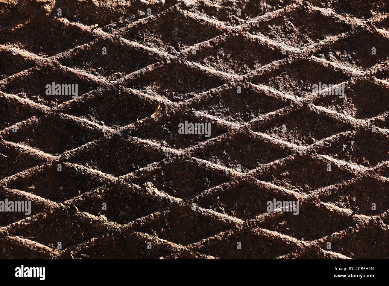 Canal cover surface texture. Rusty iron square pattern. Rusty metal ...