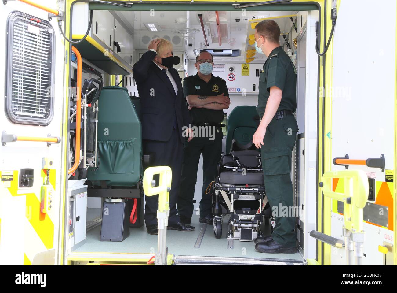 Prime Minister Boris Johnson talks to a paramedic (centre) and trainee ...