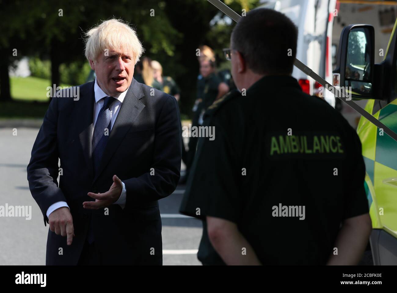 Prime Minister Boris Johnson talks to a paramedic at the Northern ...