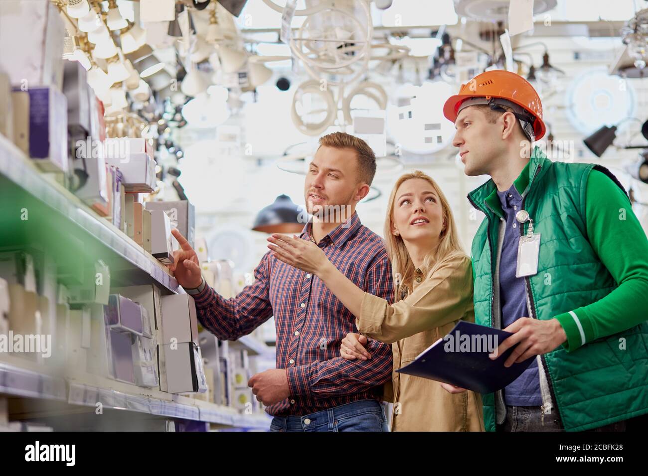 beautiful couple customers asked for help and advice from warehouse ...