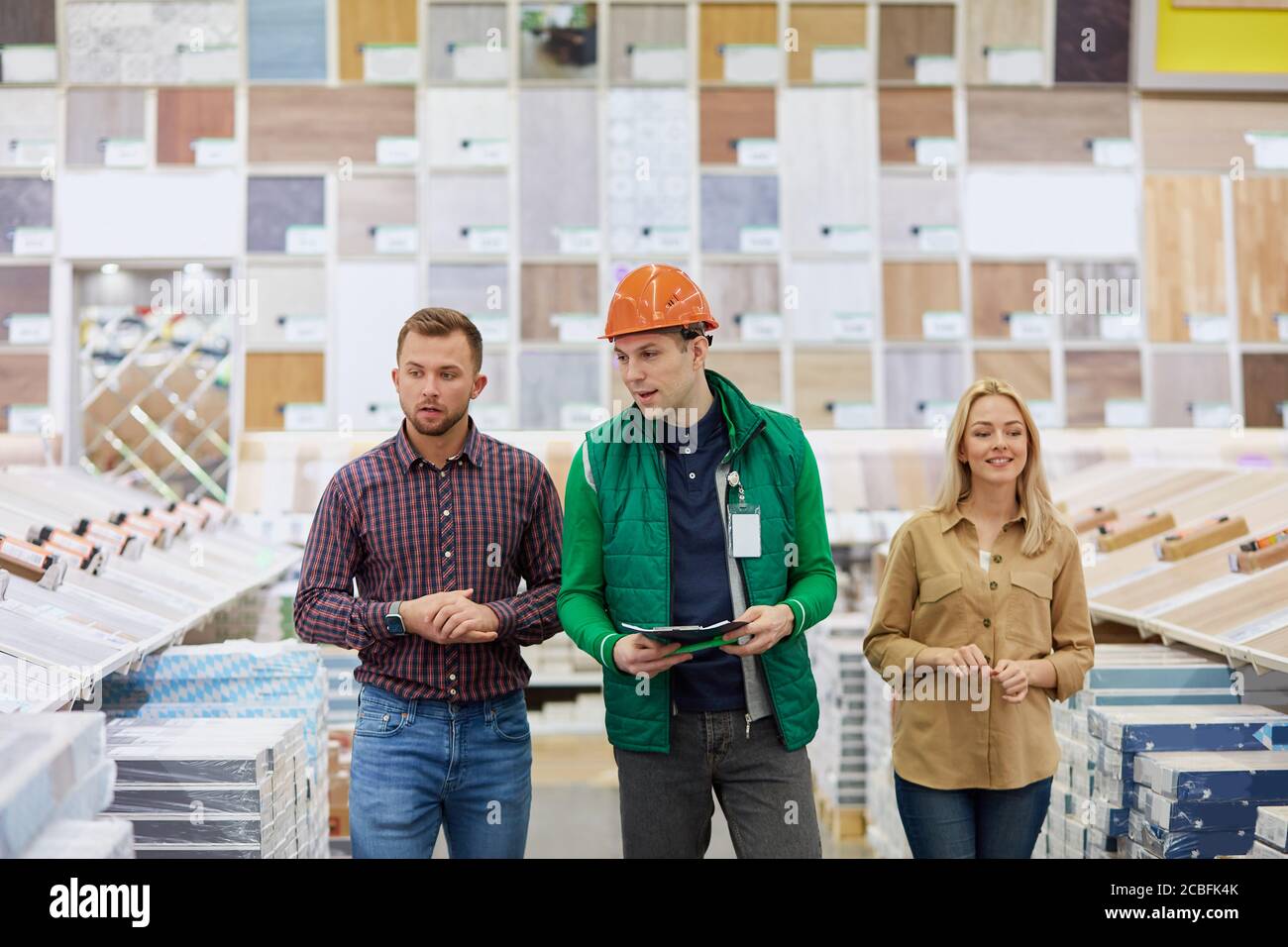 beautiful couple customers asked for help and advice from warehouse ...