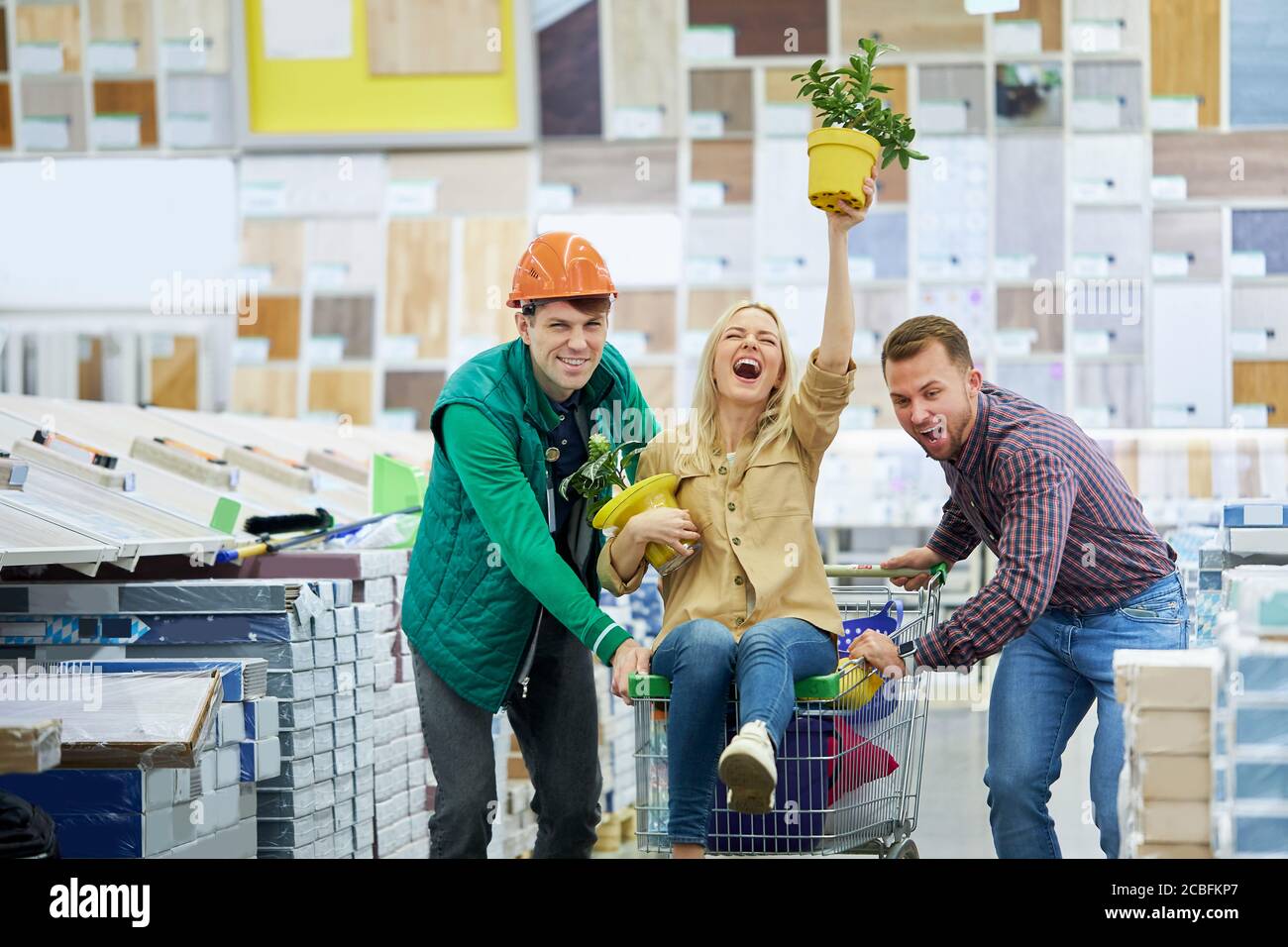 customers have fun, ride on trolley while shopping in store. good ...