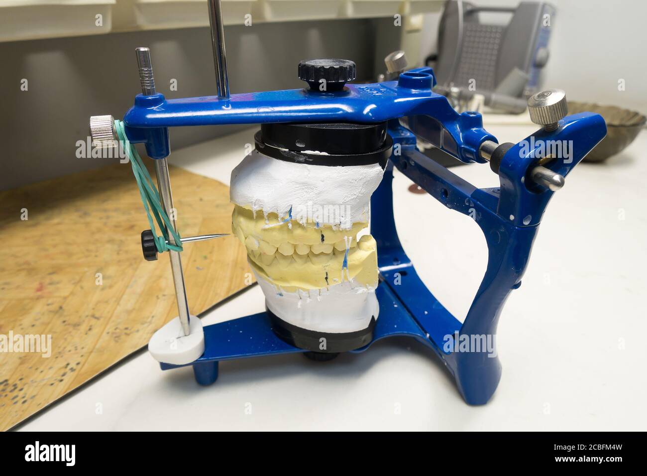 workplace of a dental technician with plaster models in an articulator ...