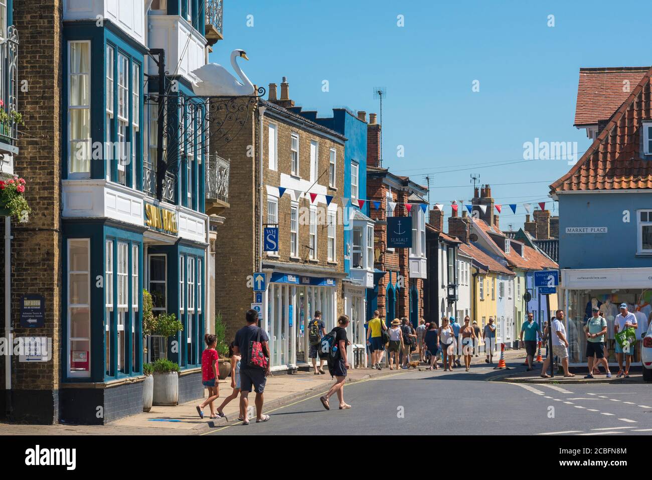 Southwold Suffolk, view in summer of people walking in the High Street ...
