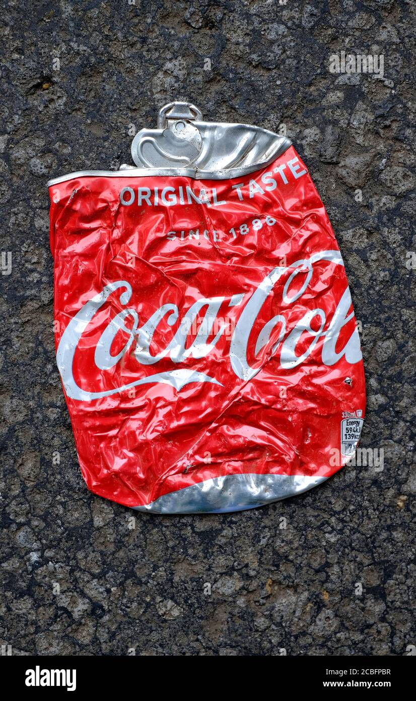 squashed red coca cola can flattened on tarmac road, norfolk, england ...