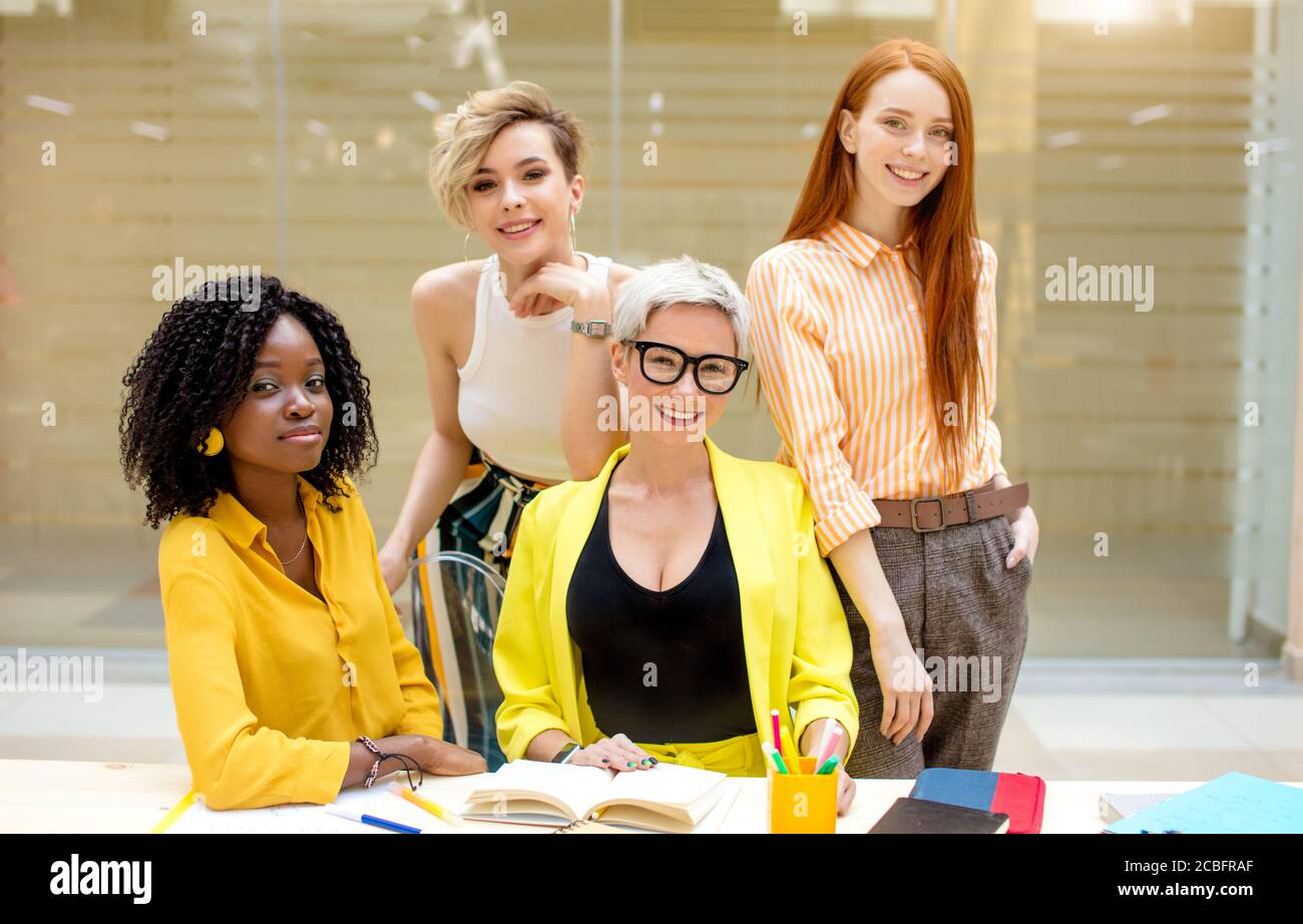 Happy friendly carming business team in the office. close up photo ...