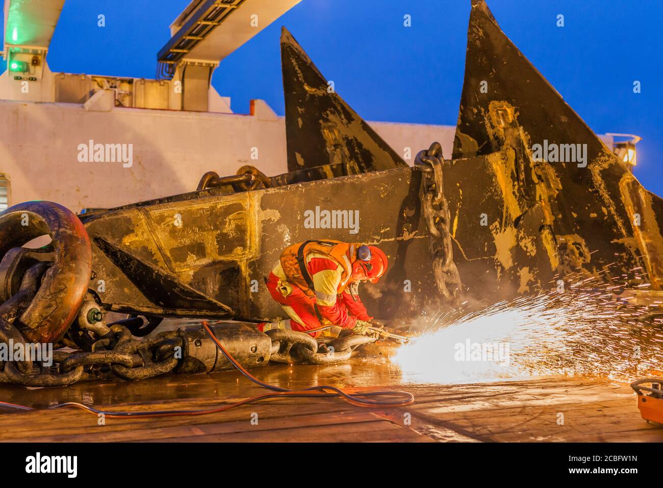NORTH SEA, SCOTLAND - 2016 MARCH 24. Deck crew cutting oil rig chain on ...