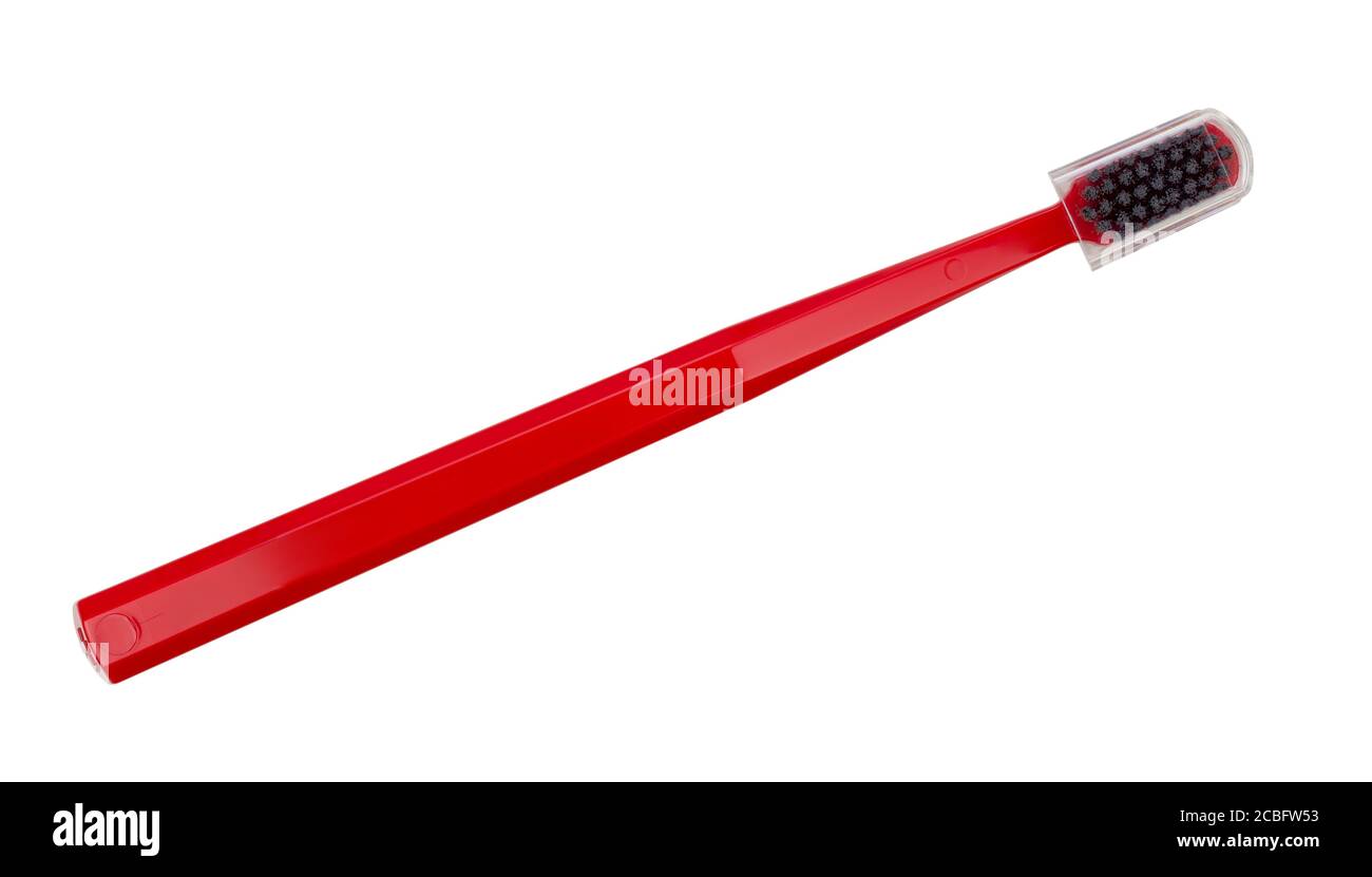 Red toothbrush with a plastic transparent lid isolated on a white ...