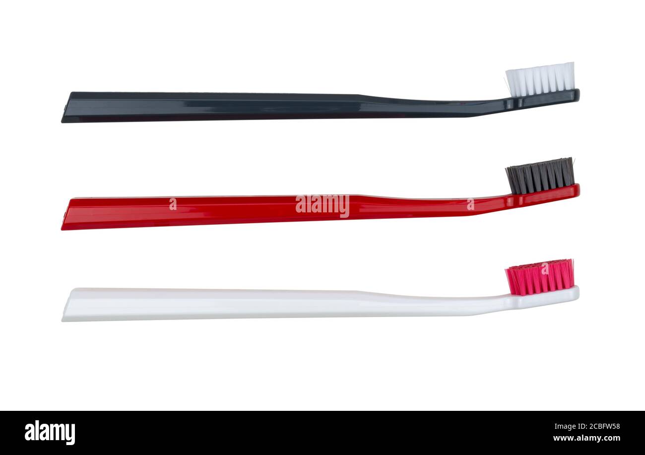 New toothbrushes - white, red and black - isolated on a white ...