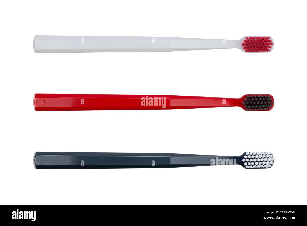 New toothbrushes - black, red and white - isolated on a white ...