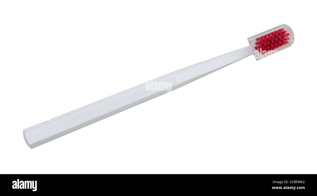 White toothbrush with a transparent plastic lid isolated on a white ...