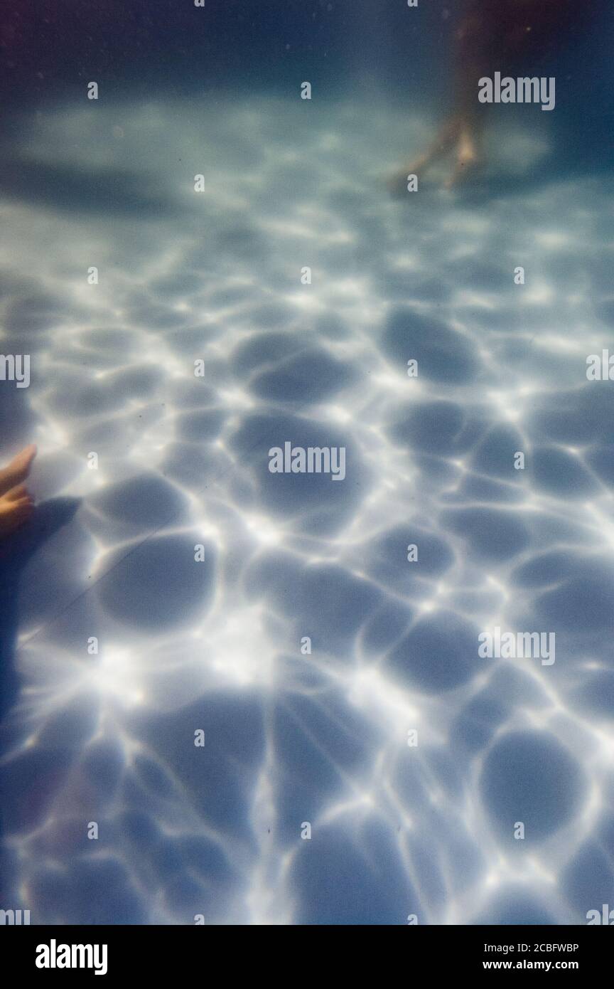 View of the bottom of a swimming pool with a rippled light effect Stock ...