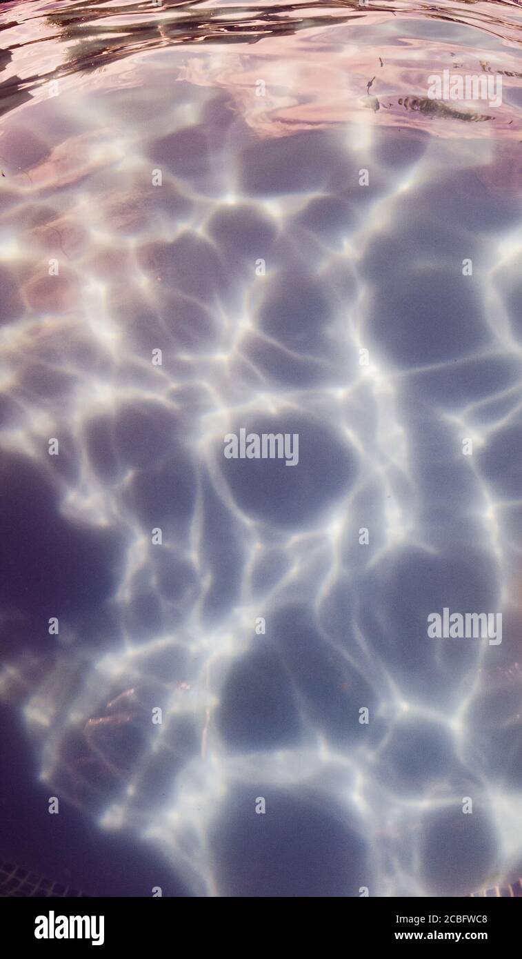 View of the bottom of a swimming pool with a rippled light effect Stock ...