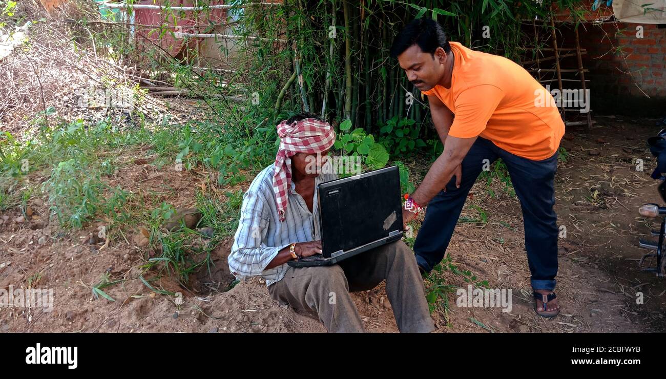 DISTRICT KATNI, INDIA - AUGUST 20, 2019: An indian village man learning ...