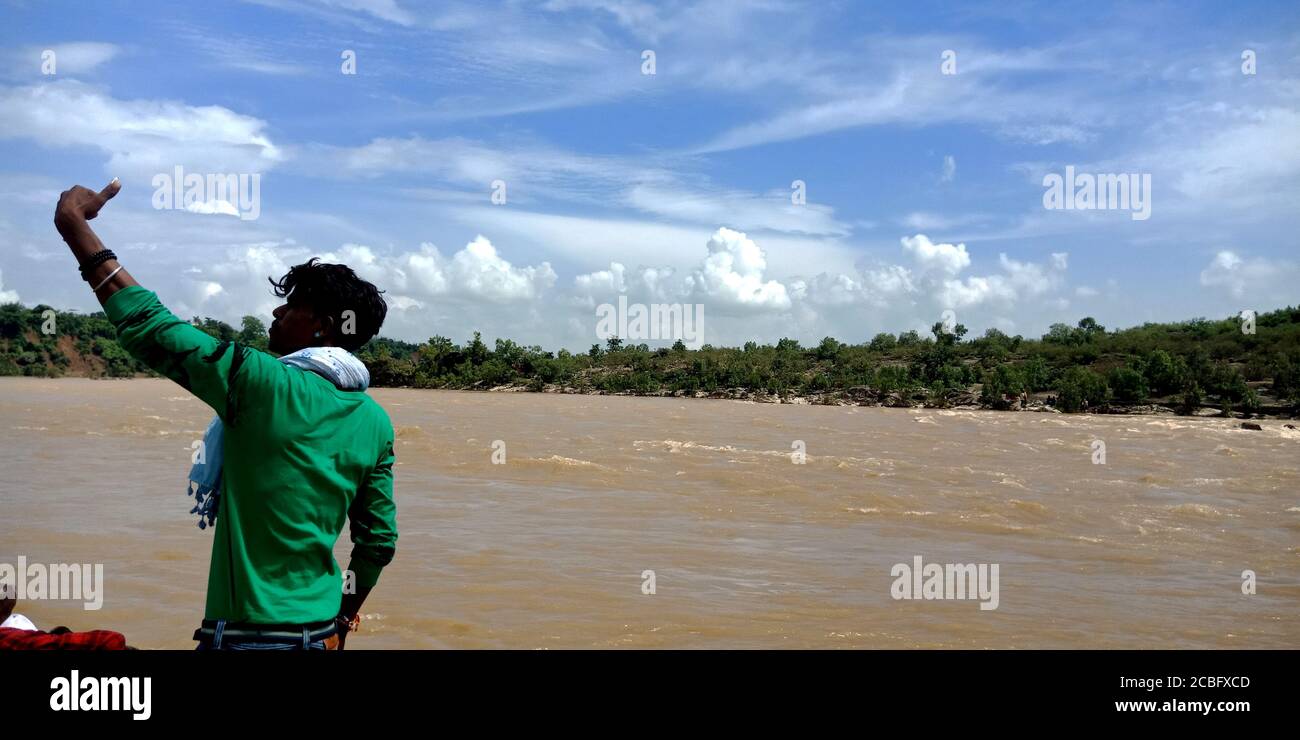 DISTRICT JABALPUR, INDIA - AUGUST 24, 2019: An indian man clicking ...