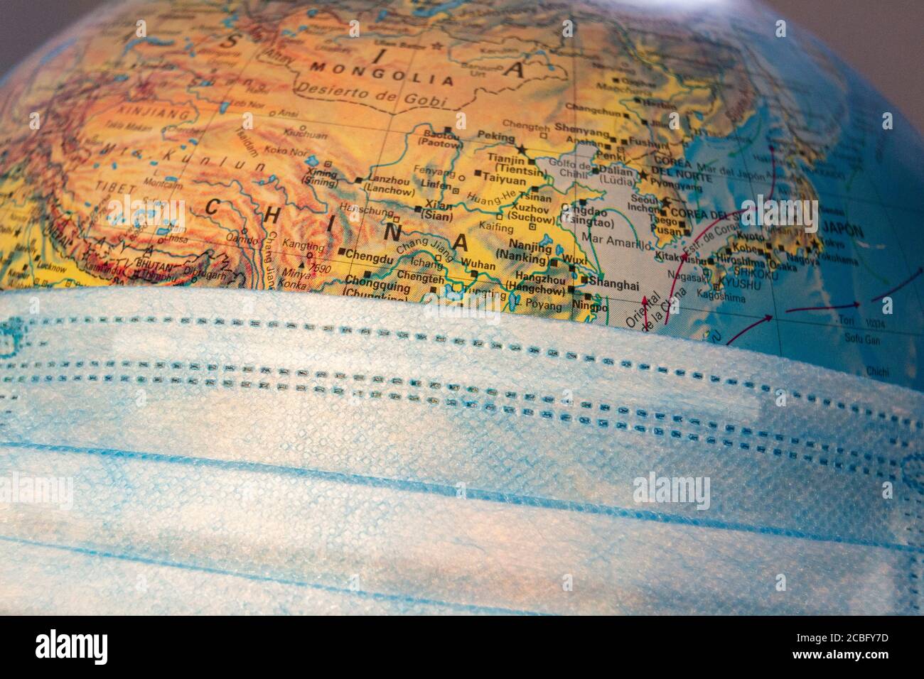 The world with a disposable medical mask due to the Coronavirus (COVID ...