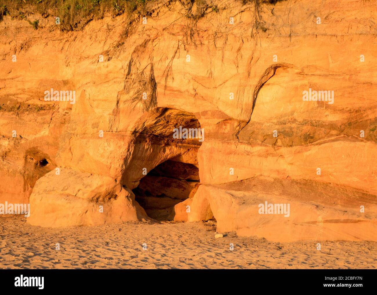 Sandstone cliffs in sunset light, golden hour before sunset, summer ...