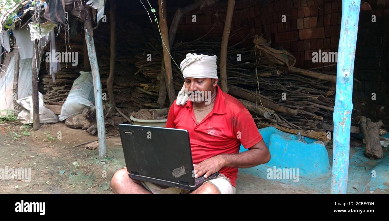 DISTRICT KATNI, INDIA - AUGUST 14, 2019: An indian village man learning ...