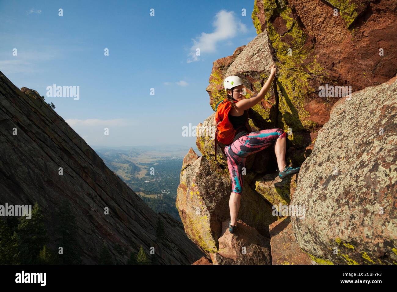 A woman climbs to the summit of the Second Flatiron without a rope ...