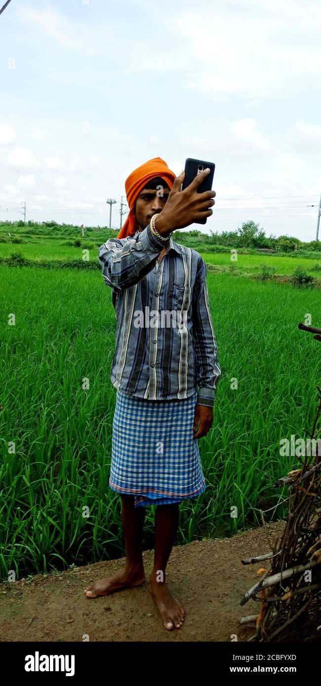 DISTRICT KATNI, INDIA - AUGUST 14, 2019: An indian village farmer doing ...