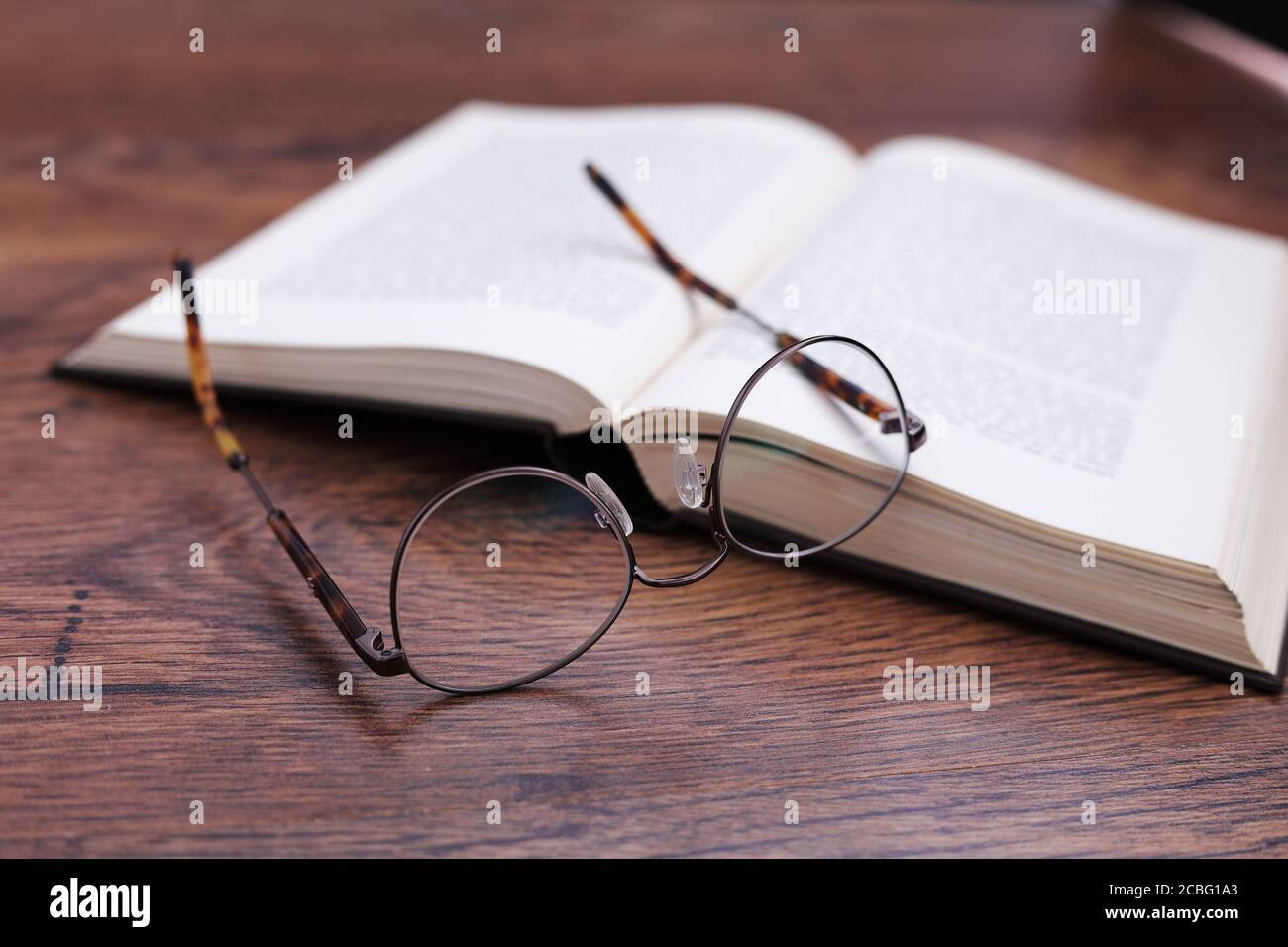 Eyeglasses and notebook on wood background hi-res stock photography and ...