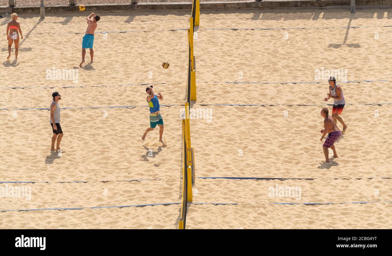 People play volley ball Yellow Wave, Brighton, East Sussex, UK Stock ...