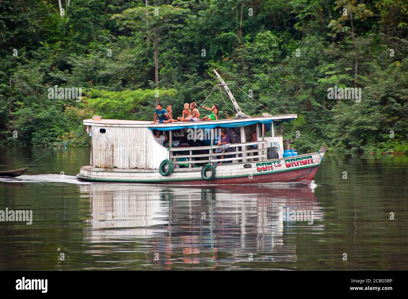 Amazon River, a small house boat sails on the river Stock Photo - Alamy