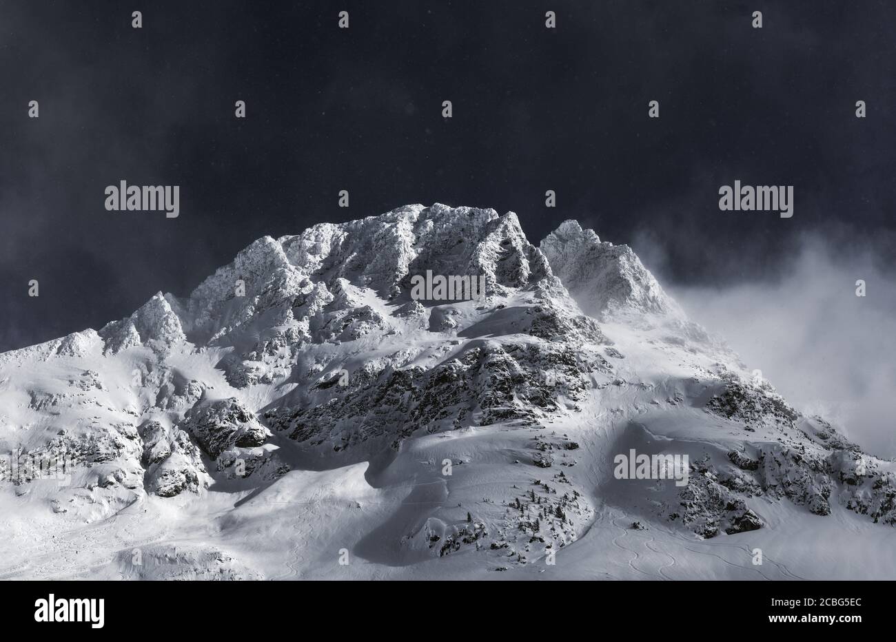 Dramatic panorama of ice-covered peak of Blackcomb Mountain and diamond ...