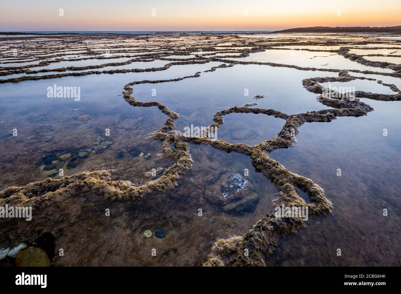 Seascape of Vila Nova Milfontes during low tide, at sunset Stock Photo ...