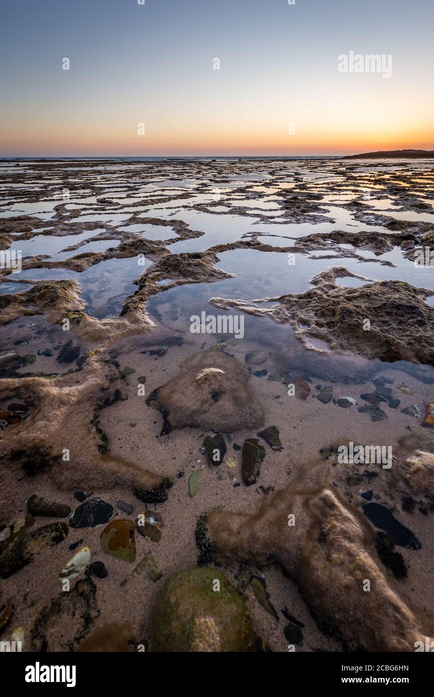 Seascape of Vila Nova Milfontes during low tide, at sunset Stock Photo ...