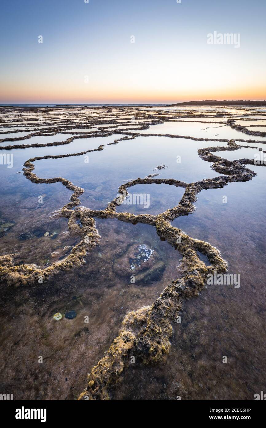 Seascape of Vila Nova Milfontes during low tide, at sunset Stock Photo ...