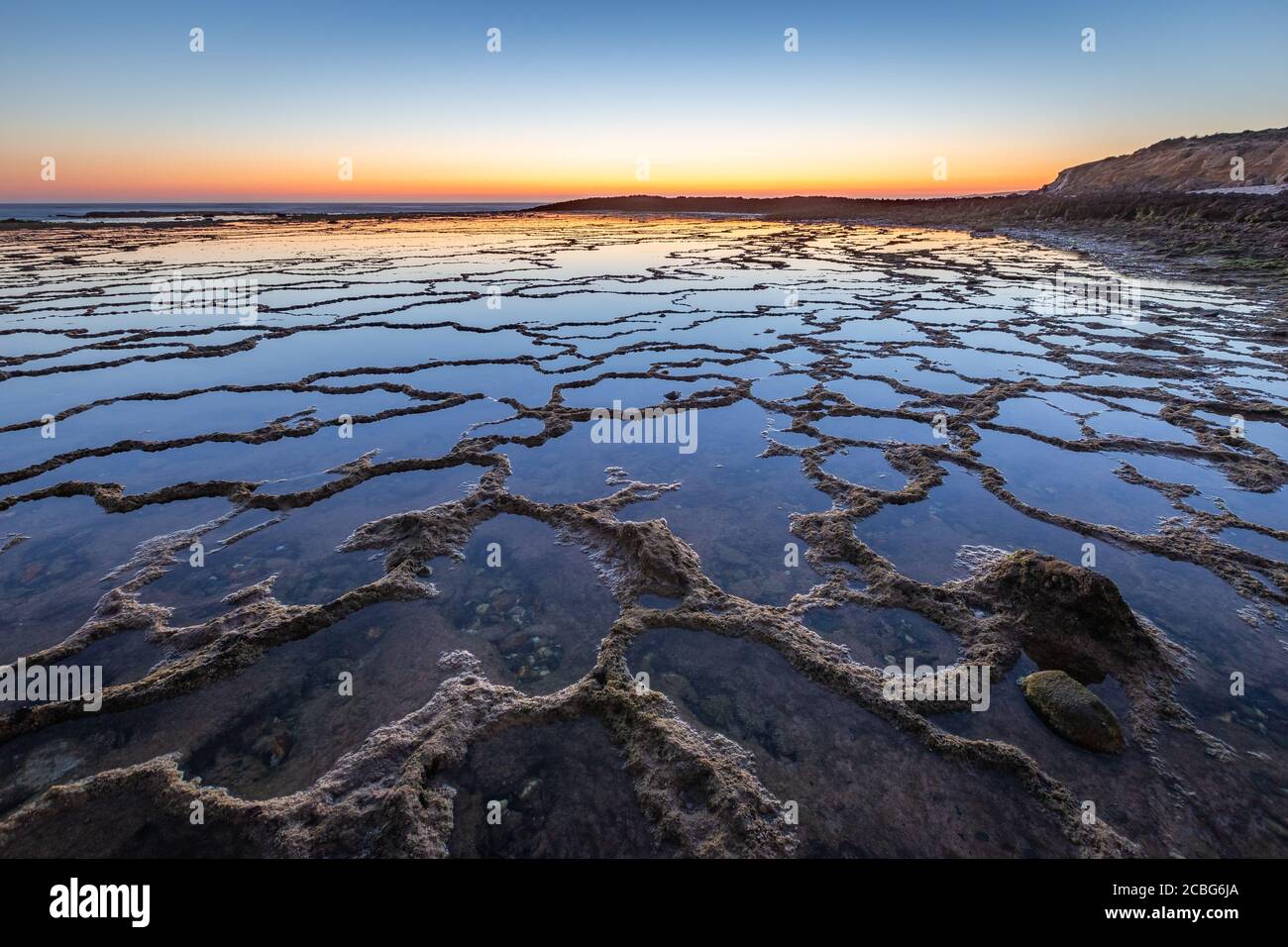 Seascape of Vila Nova Milfontes during low tide, at sunset Stock Photo ...