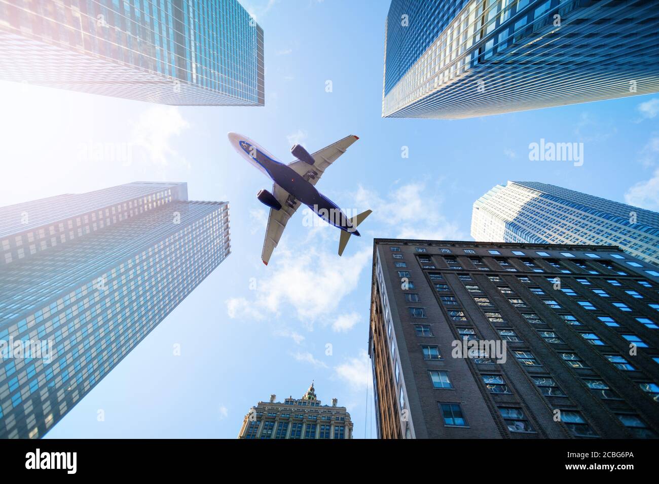 Plane over buildings new york hi-res stock photography and images - Alamy