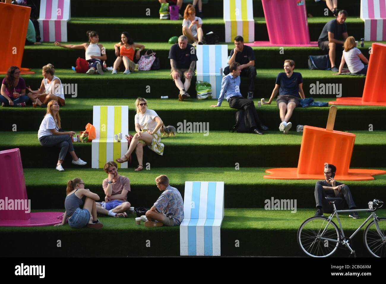 People on the steps near Granary Square, King's Cross, London as the ...