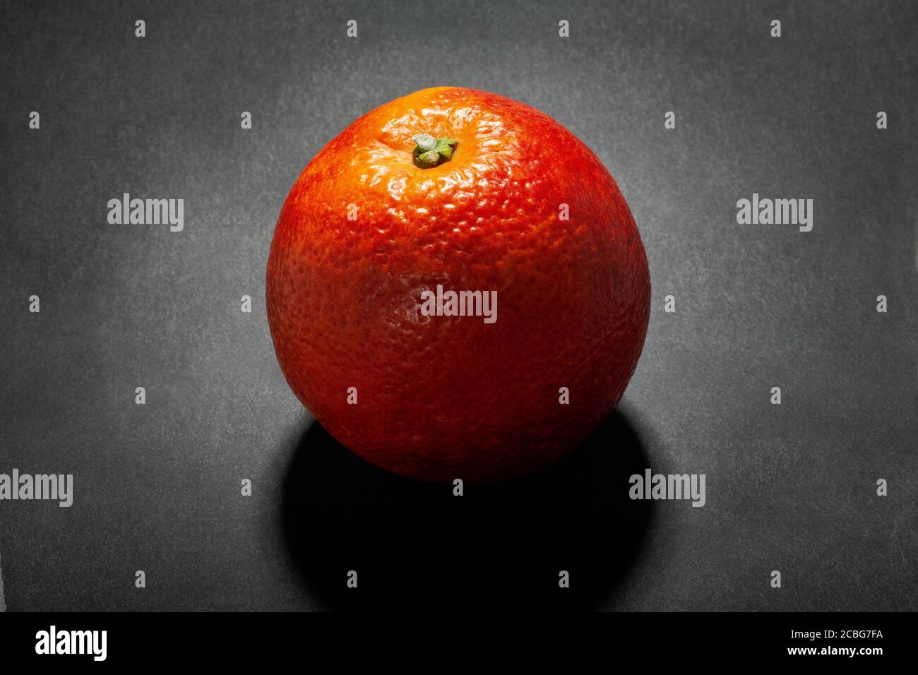 blood tangerine on black background Stock Photo - Alamy