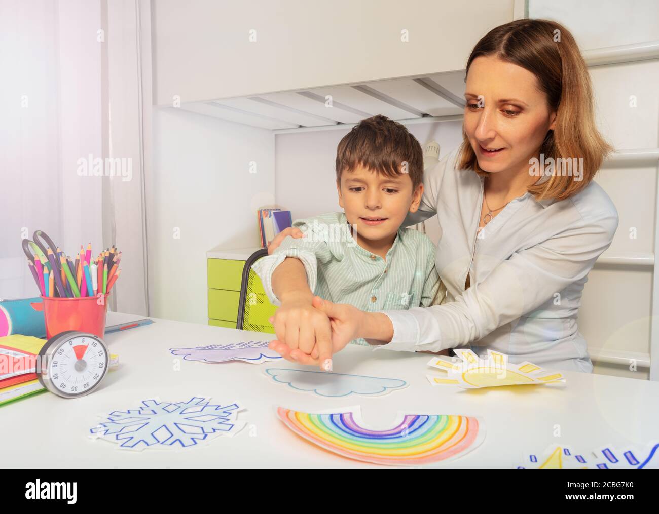 Child with autism spectrum disorder learn weather using cards, teacher ...