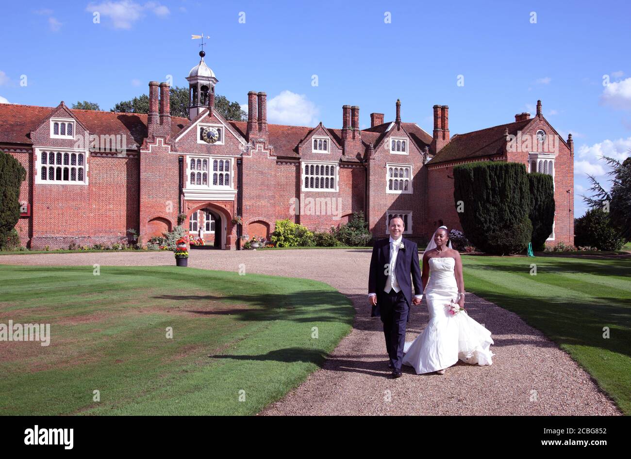 Bride and groom on their wedding day at Gosfield Hall Georgian mansion ...
